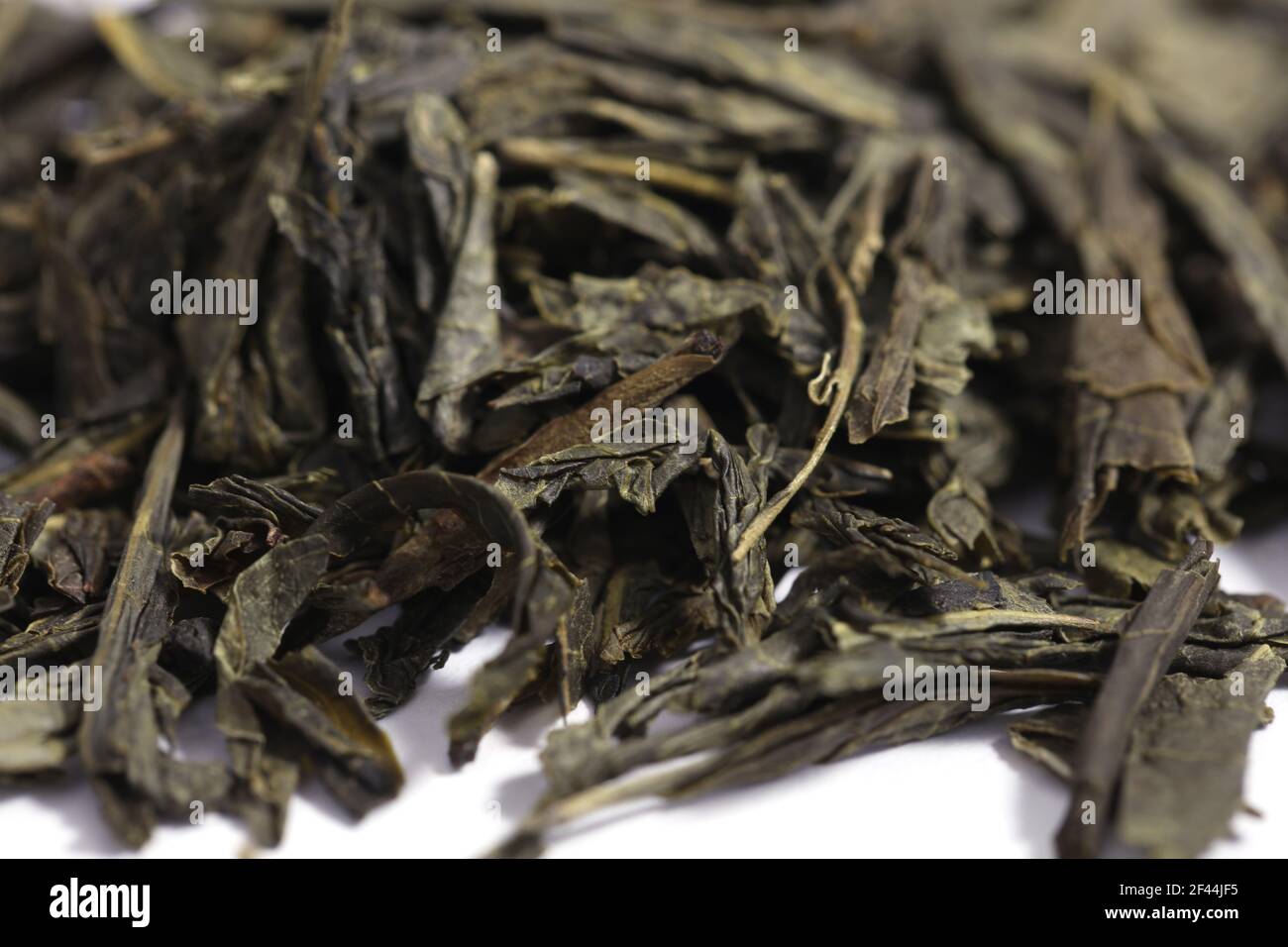 Green tea dried and with rolled leaves Stock Photo - Alamy