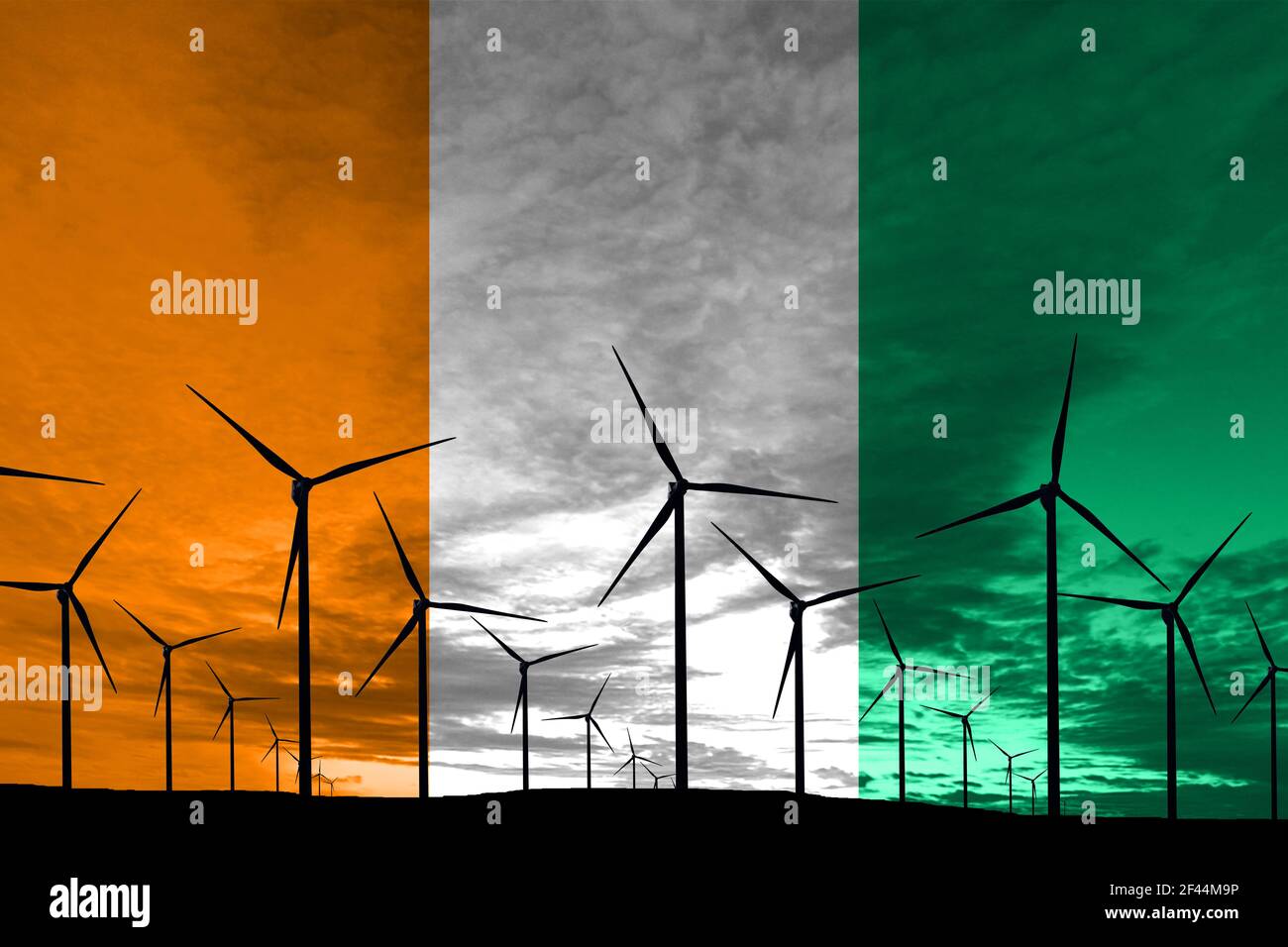 Ivory Coast flag wind farm at sunset, sustainable development ...