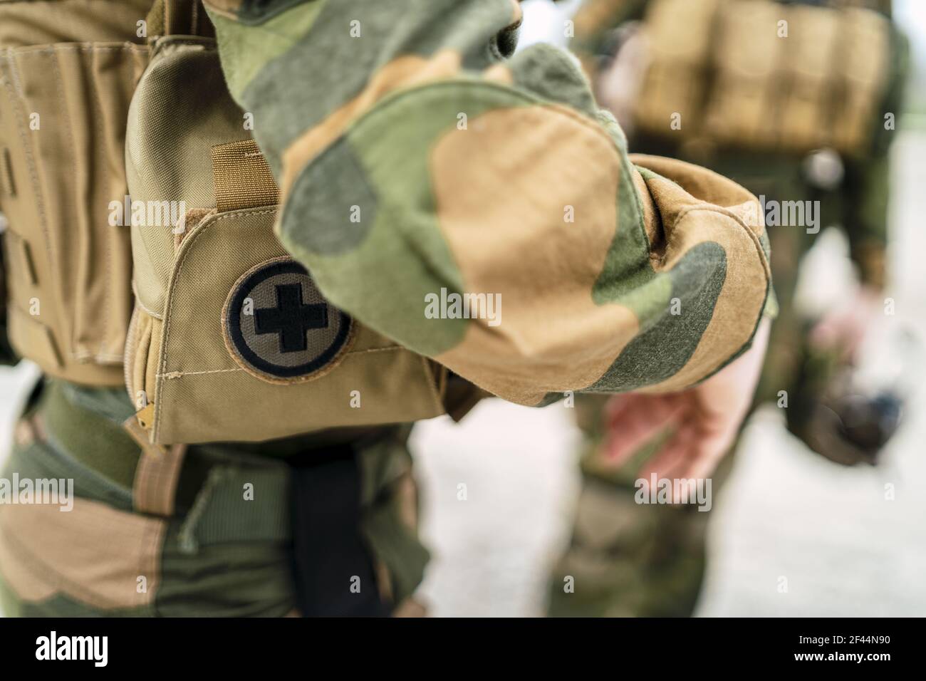 A closeup of a small first aid bag on the uniform of a special force ...