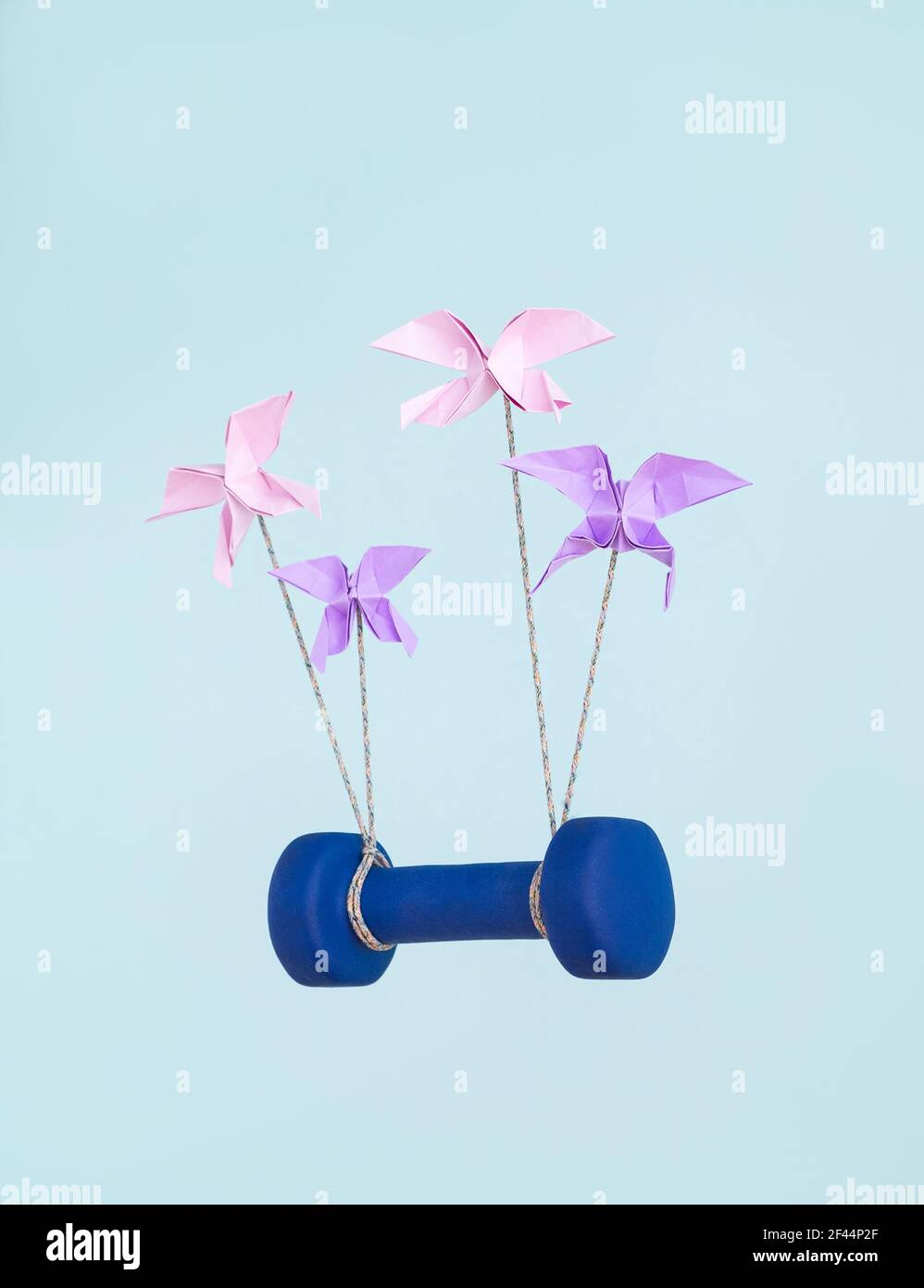 Origami butterflies in teamwork and success concept working to lift ...
