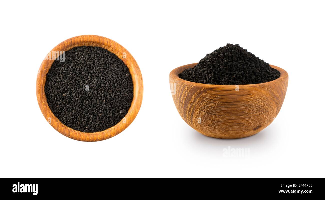 Black cumin isolated on white background. Black cumin seed in wooden ...
