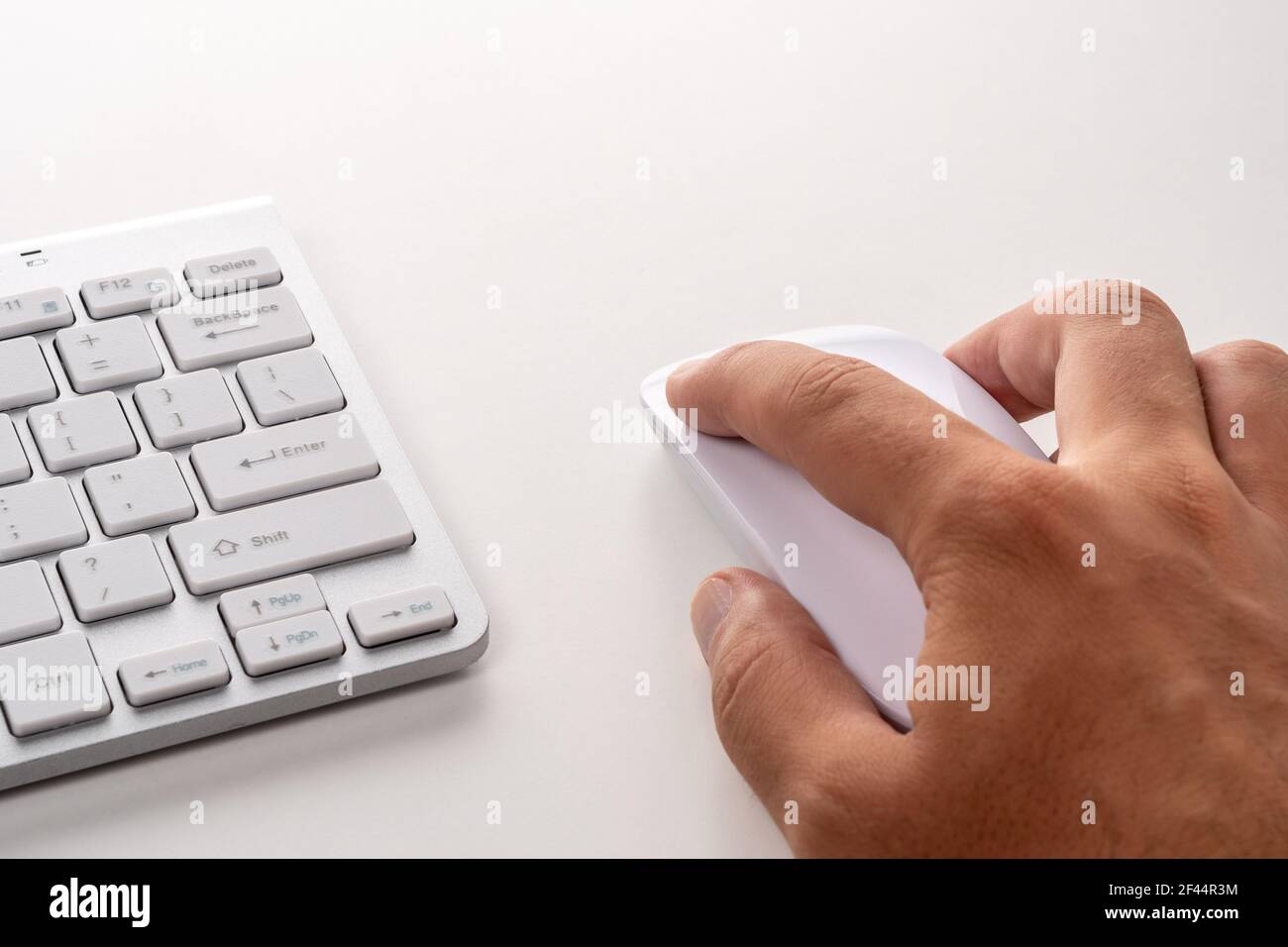 Male hand is using computer mouse. Online concept Stock Photo - Alamy