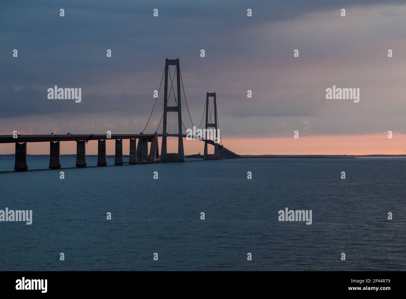Storebæltsbroen bridge. The sun is setting Stock Photo - Alamy