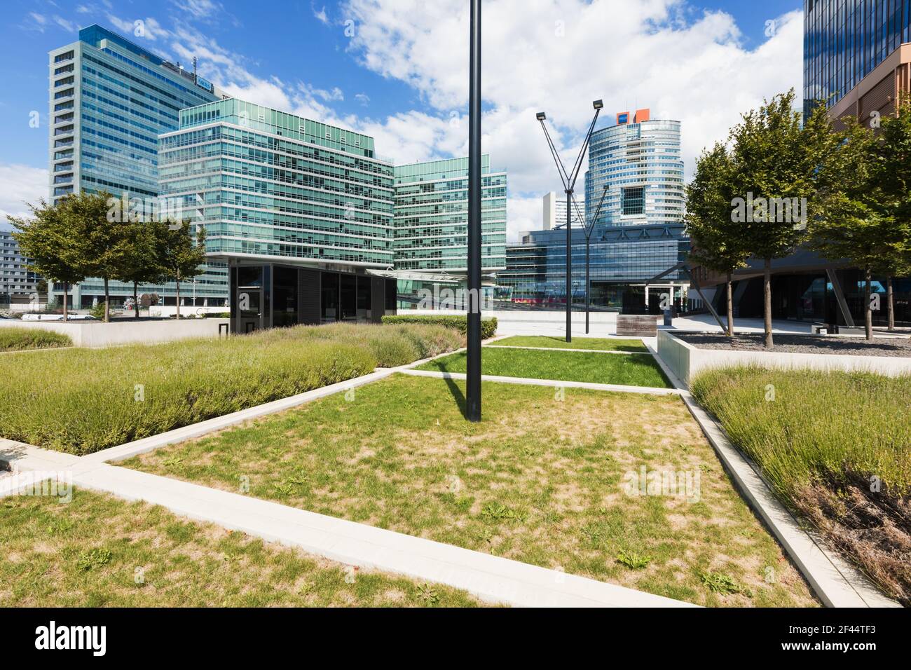 Green square and modern building around in Wien Stock Photo - Alamy