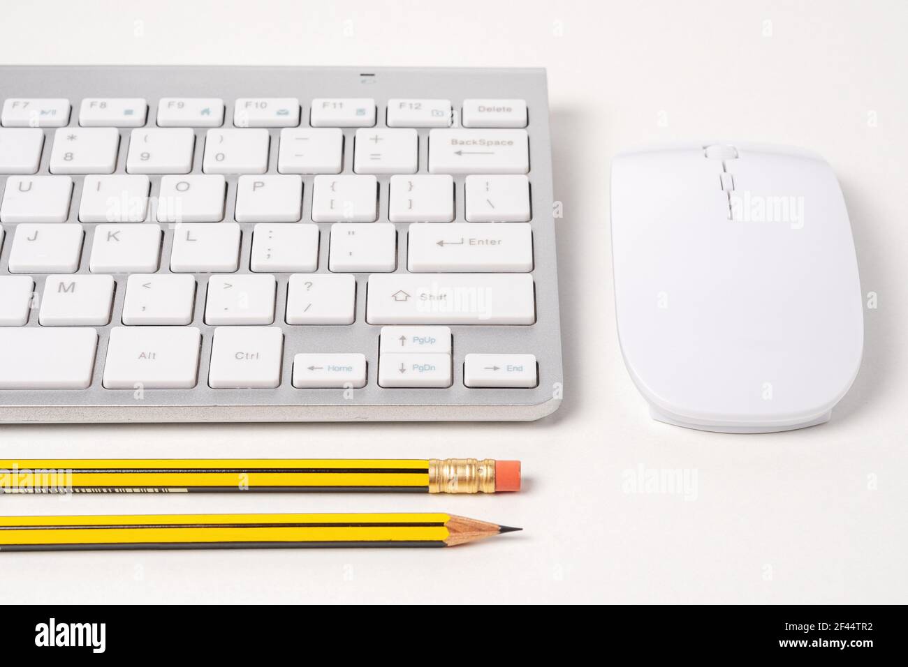 View of keyboard and mouse of a modern computer with pencils Stock ...
