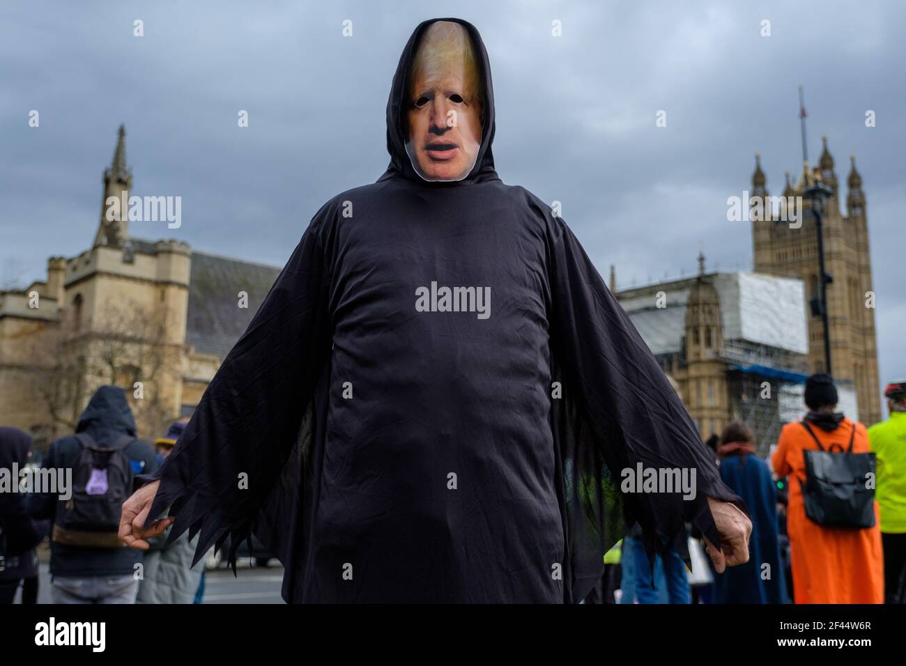 London, UK. 15th March, 2021. Protester with a Boris Johnson mask and ...