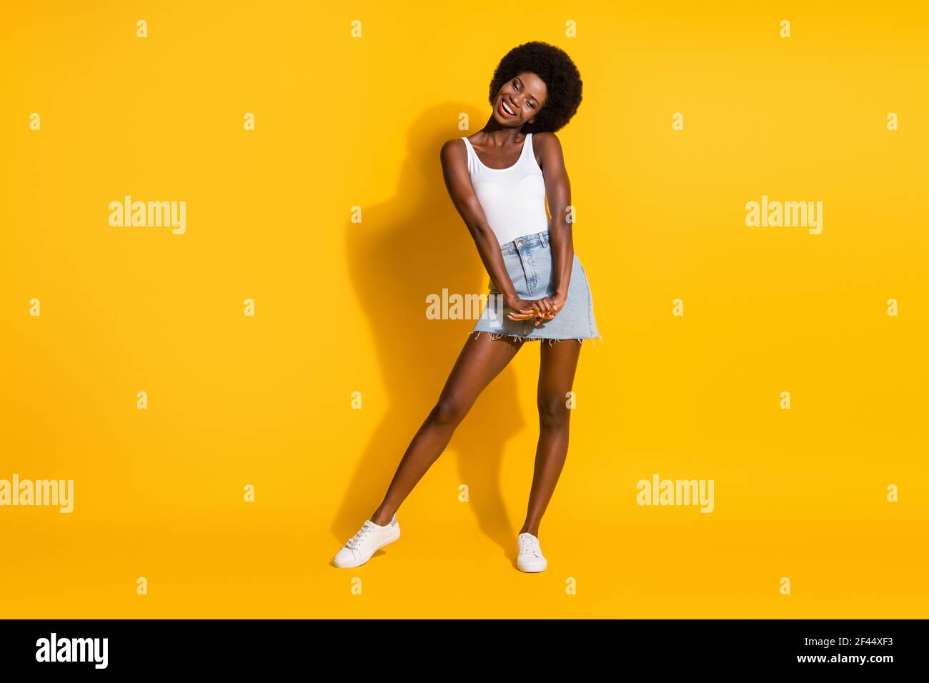 Full length body size view of pretty cheerful thin shy wavy-haired lady ...