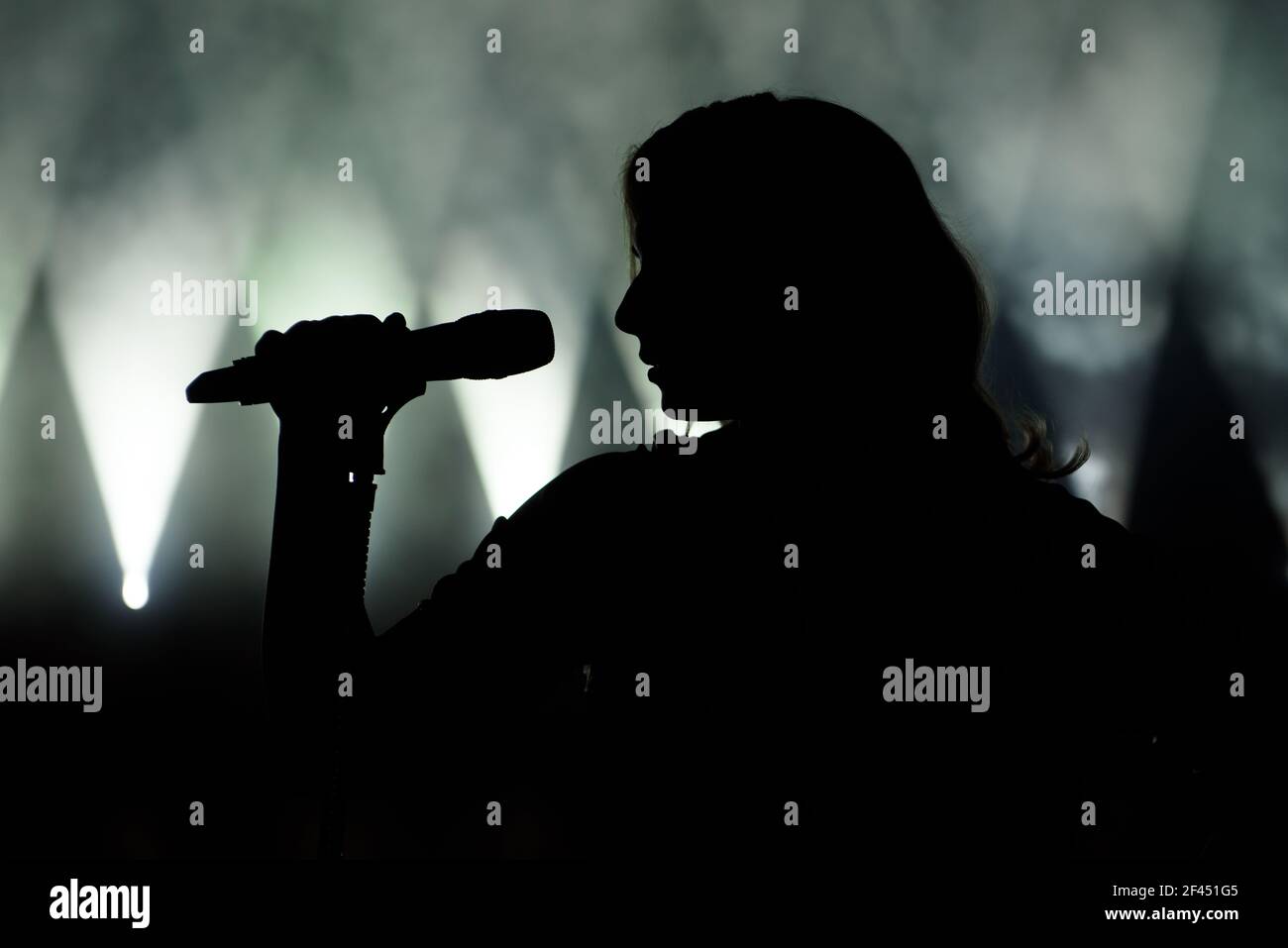 Singer in silhouette. Close up image of live singer on stage Stock ...