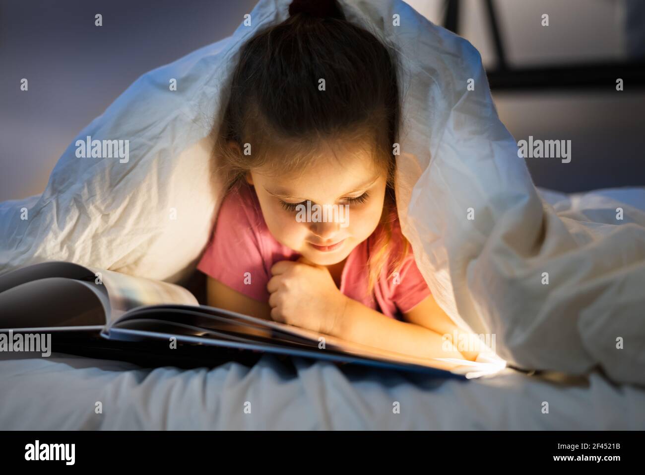 Little Child Reading Book With Fairy Tale Story Stock Photo - Alamy