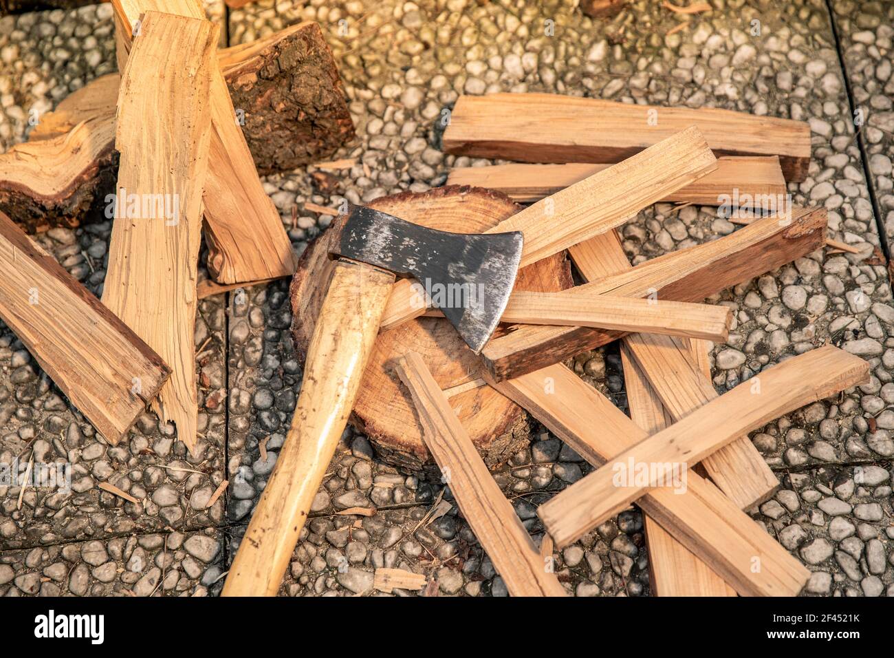 Preparation of wood to light a fire to cook food on grill outdoor ...