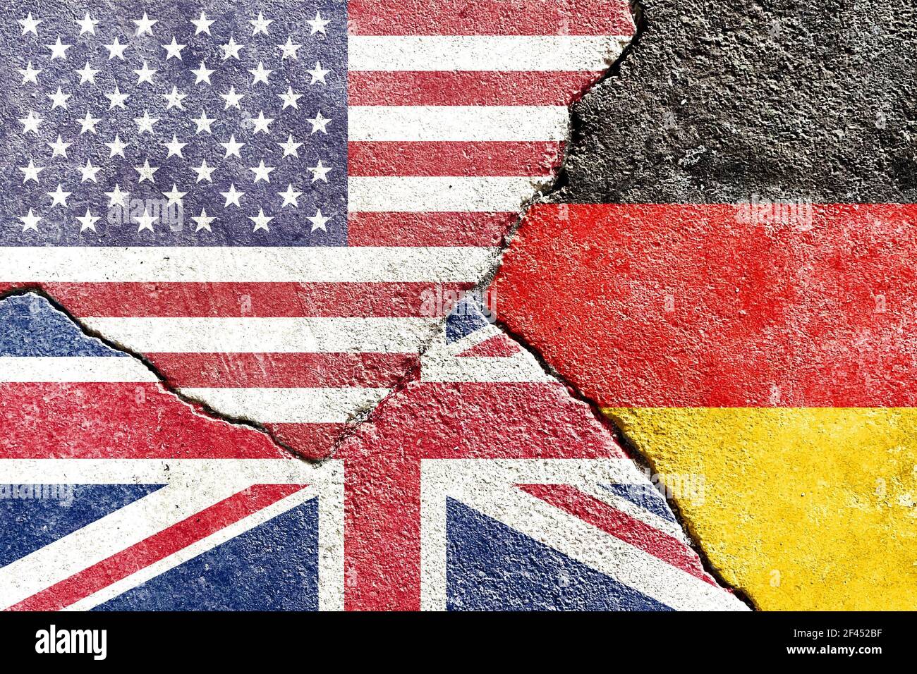 A view of USA Germany UK flags icon on weathered cracked wall ...