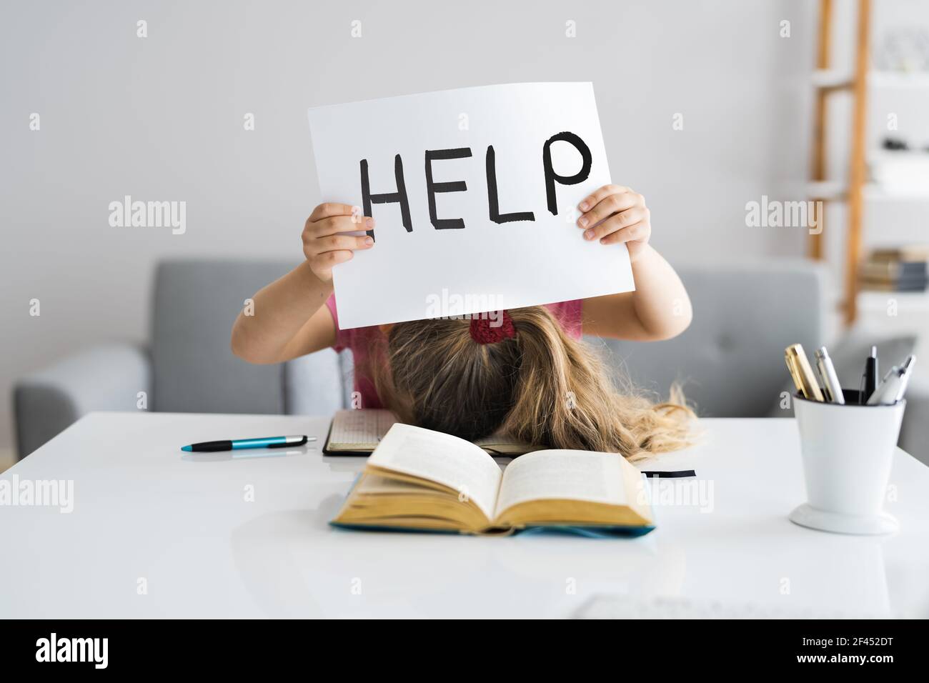 Tired Sad Kid From Homework With Help Sign Stock Photo - Alamy