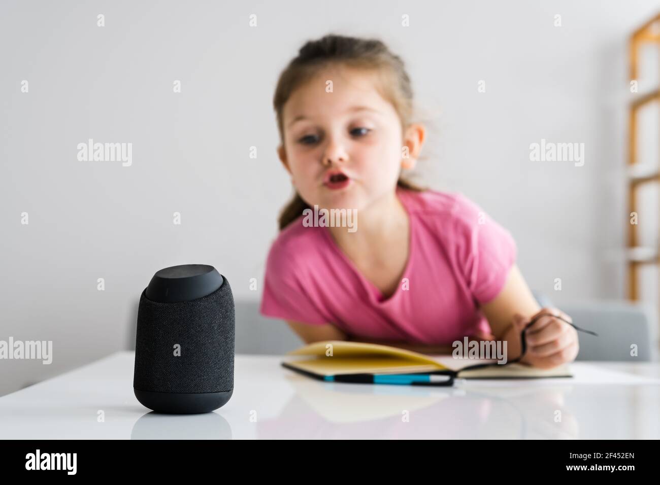 Child Kid Using Smart Speaker And Voice Assistant Stock Photo - Alamy