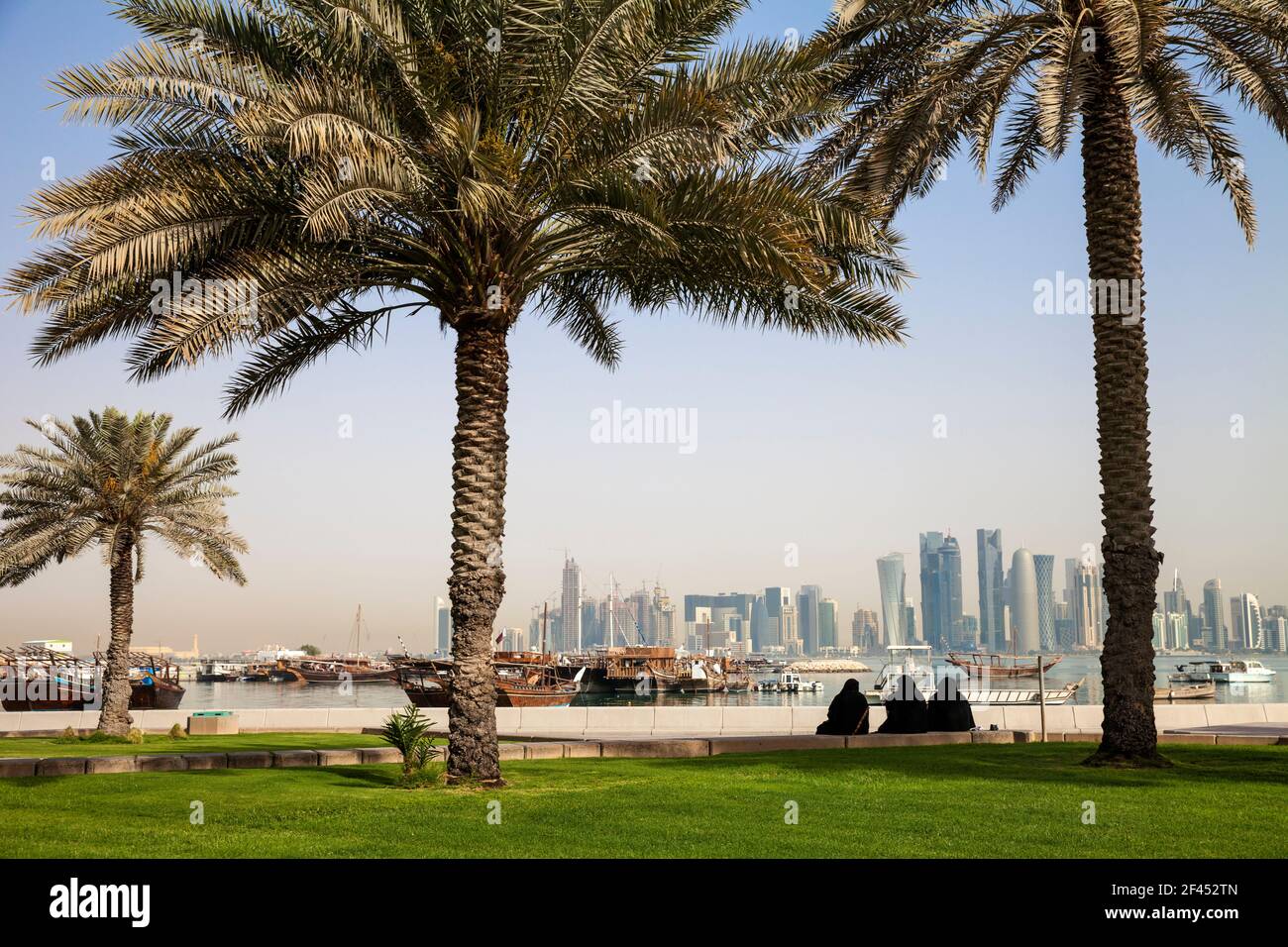 Qatar, Doha, Women sitting on The Corniche Stock Photo - Alamy