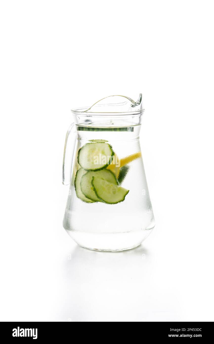 Sassy water or water with cucumber and lemon isolated on white ...