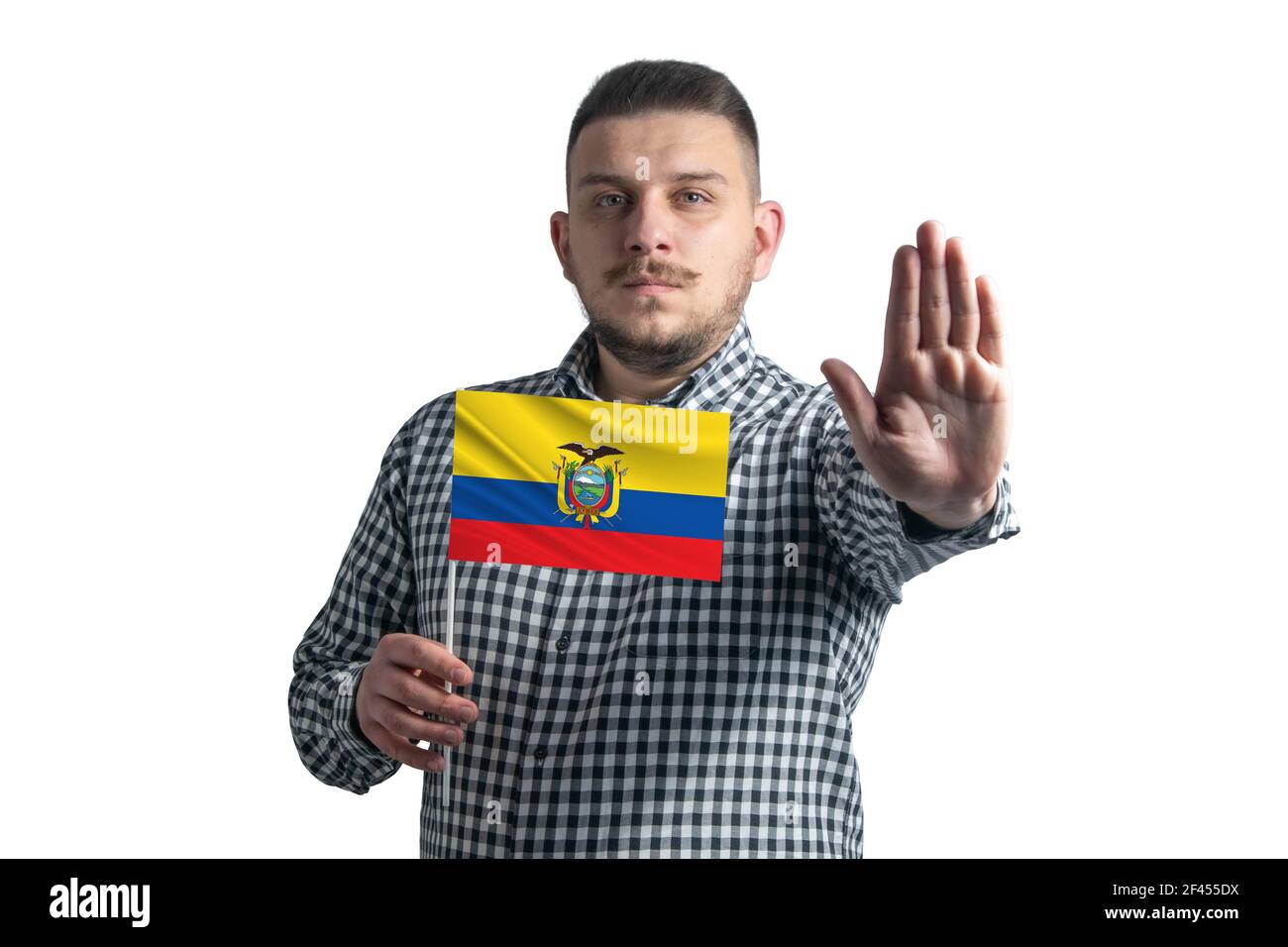 White guy holding a flag of Ecuador and with a serious face shows a ...
