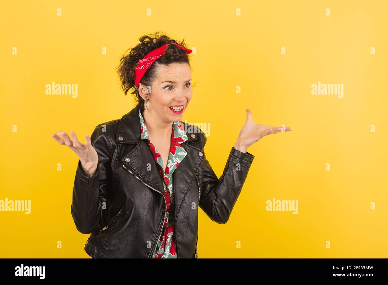 Pin up woman caught making a gesture with her hands Stock Photo - Alamy