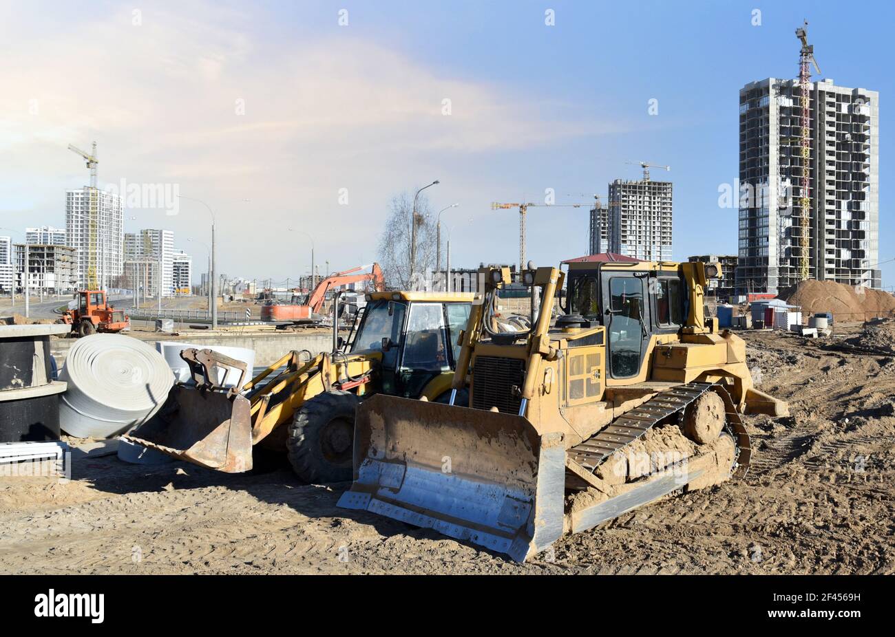 Dozer on earthmoving at construction site. Construction machinery and ...