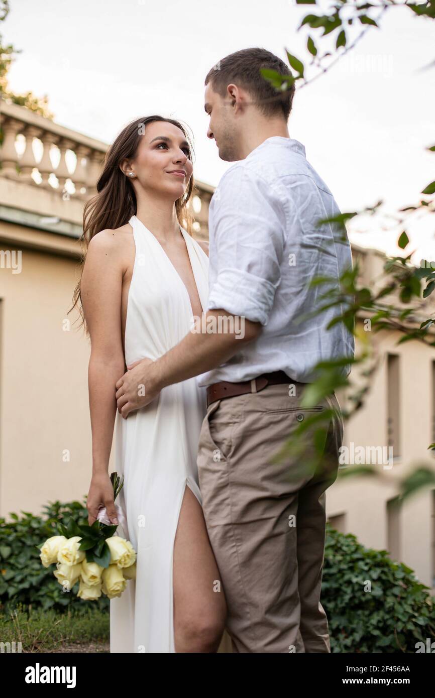 Young european white man and woman outside just married Stock Photo - Alamy