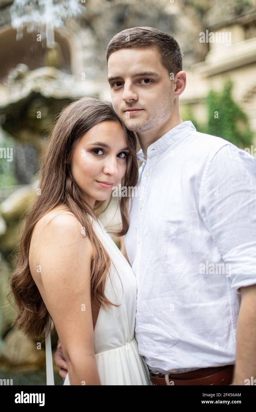 Just married young white couple portrait near the fountain Stock Photo ...