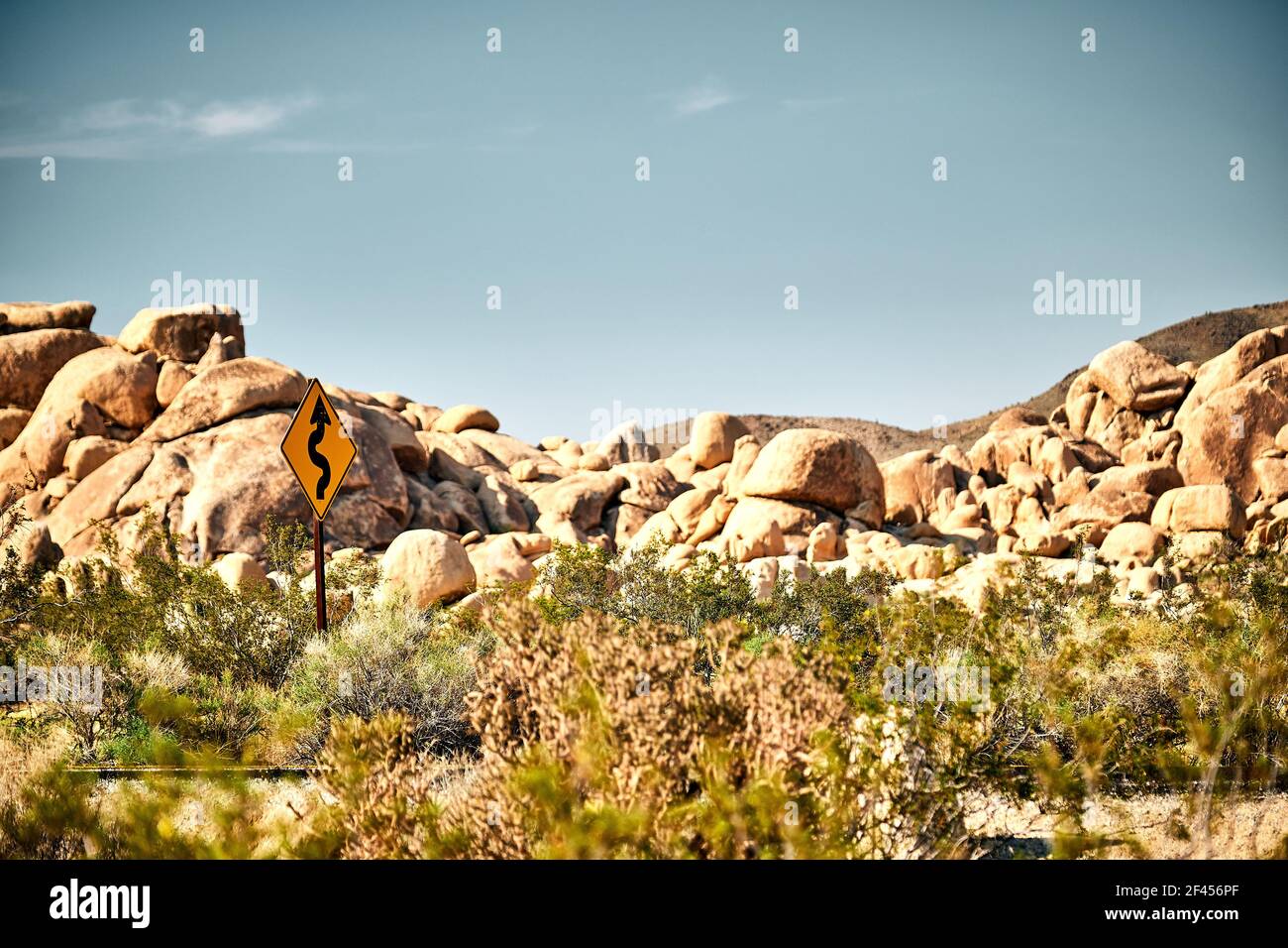 A yellow road sign showing the right way, Joshua National Tree Park ...