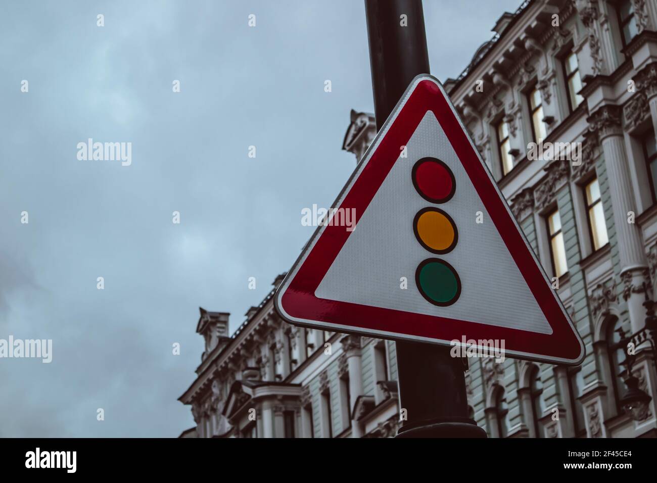 red triangle posted traffic light sign control city street safety ...
