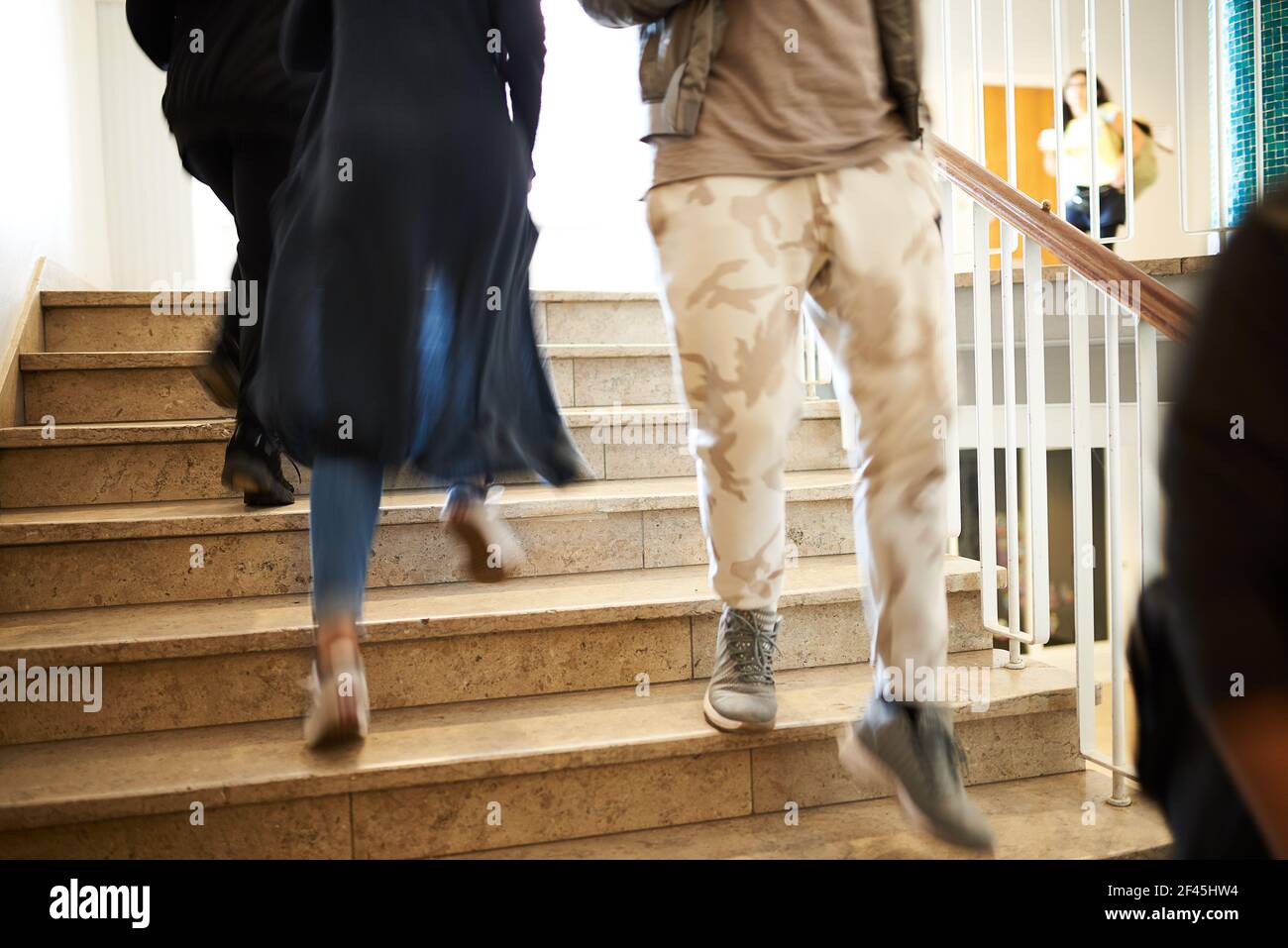 Group of people walking down stairs hi-res stock photography and images ...