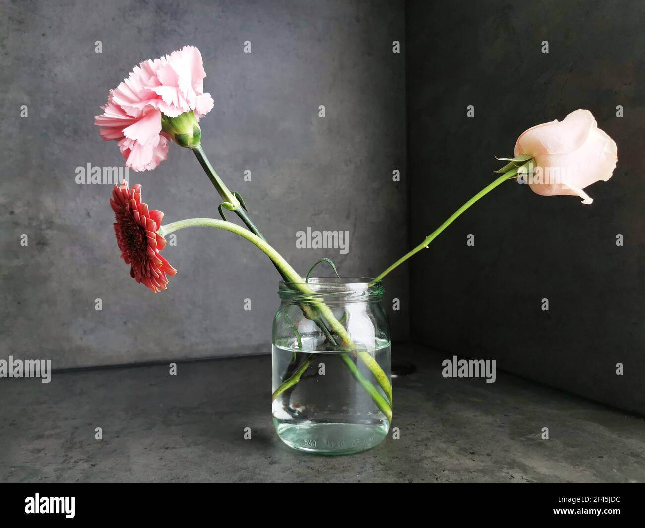 A flower vase of beautiful a fresh gerbera, carnation and rose Stock ...