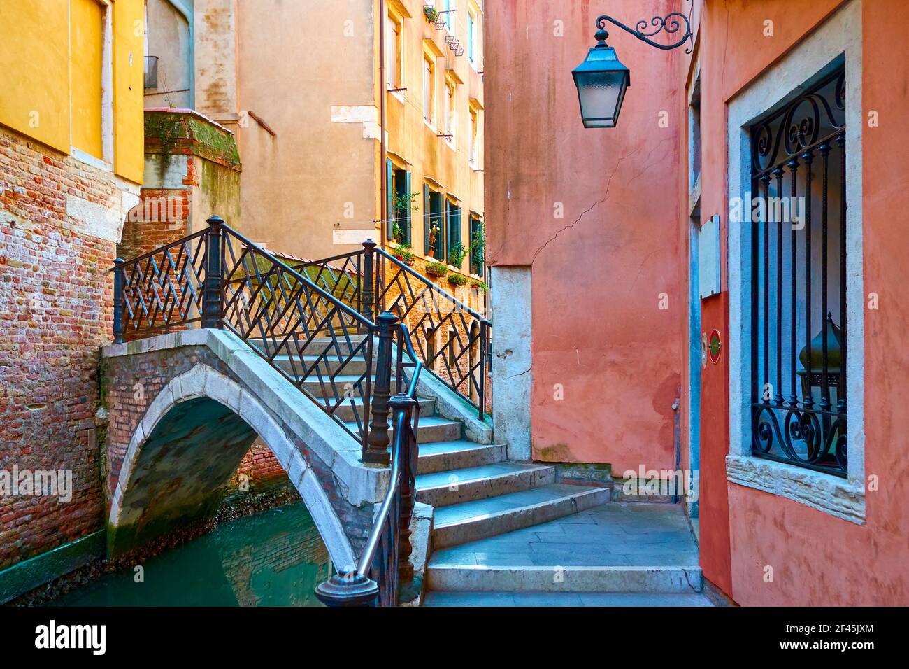 Canal with picturesque small bridge in Venice. Italy. Venetian ...
