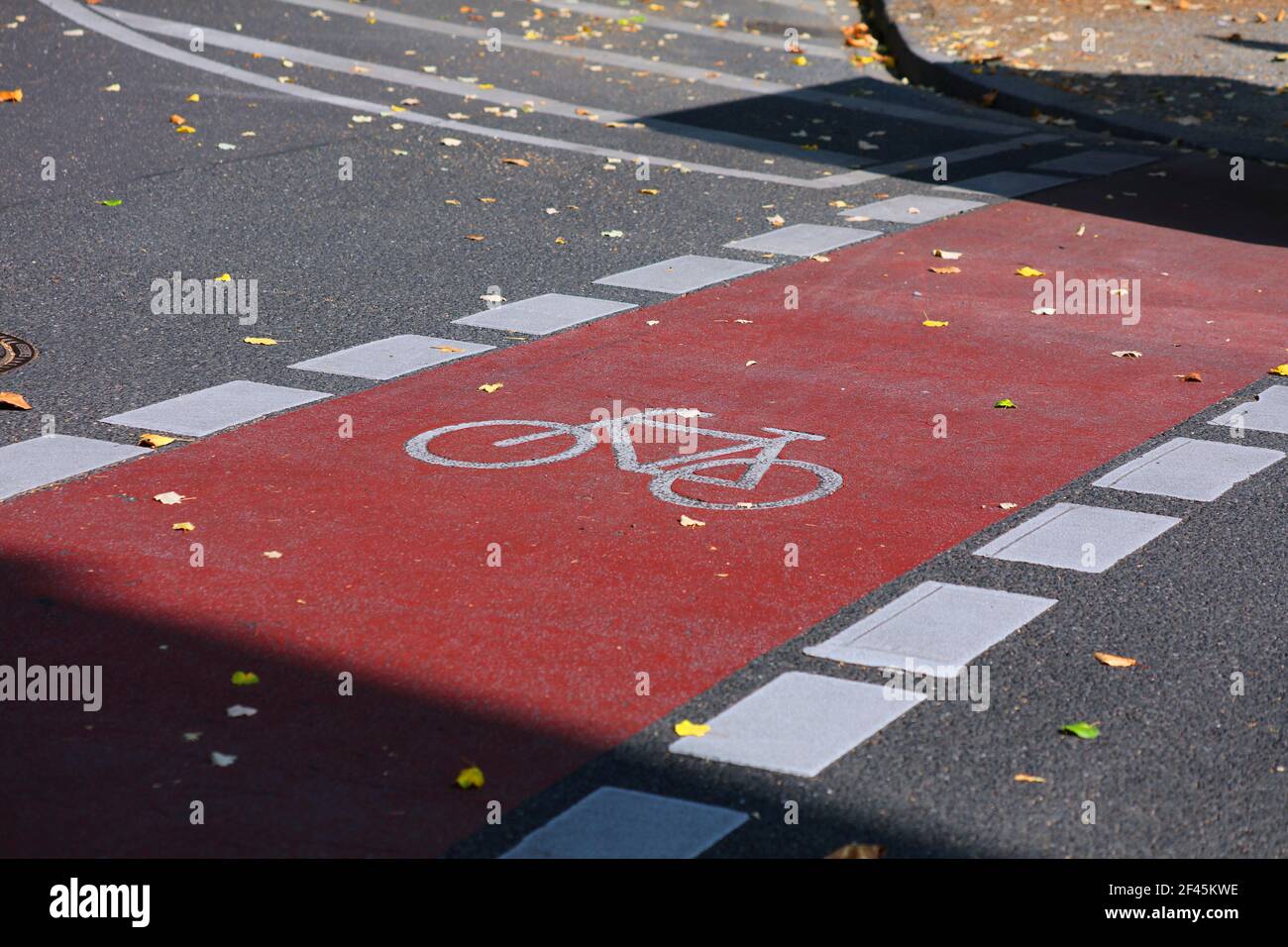 Bicycle path in Germany. Cycle path road crossing marking in ...