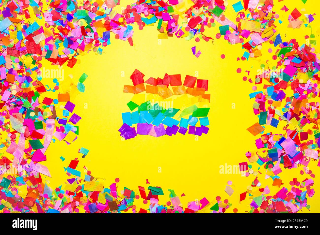 Rainbow flag, symbol of the gay community, on a yellow background made ...