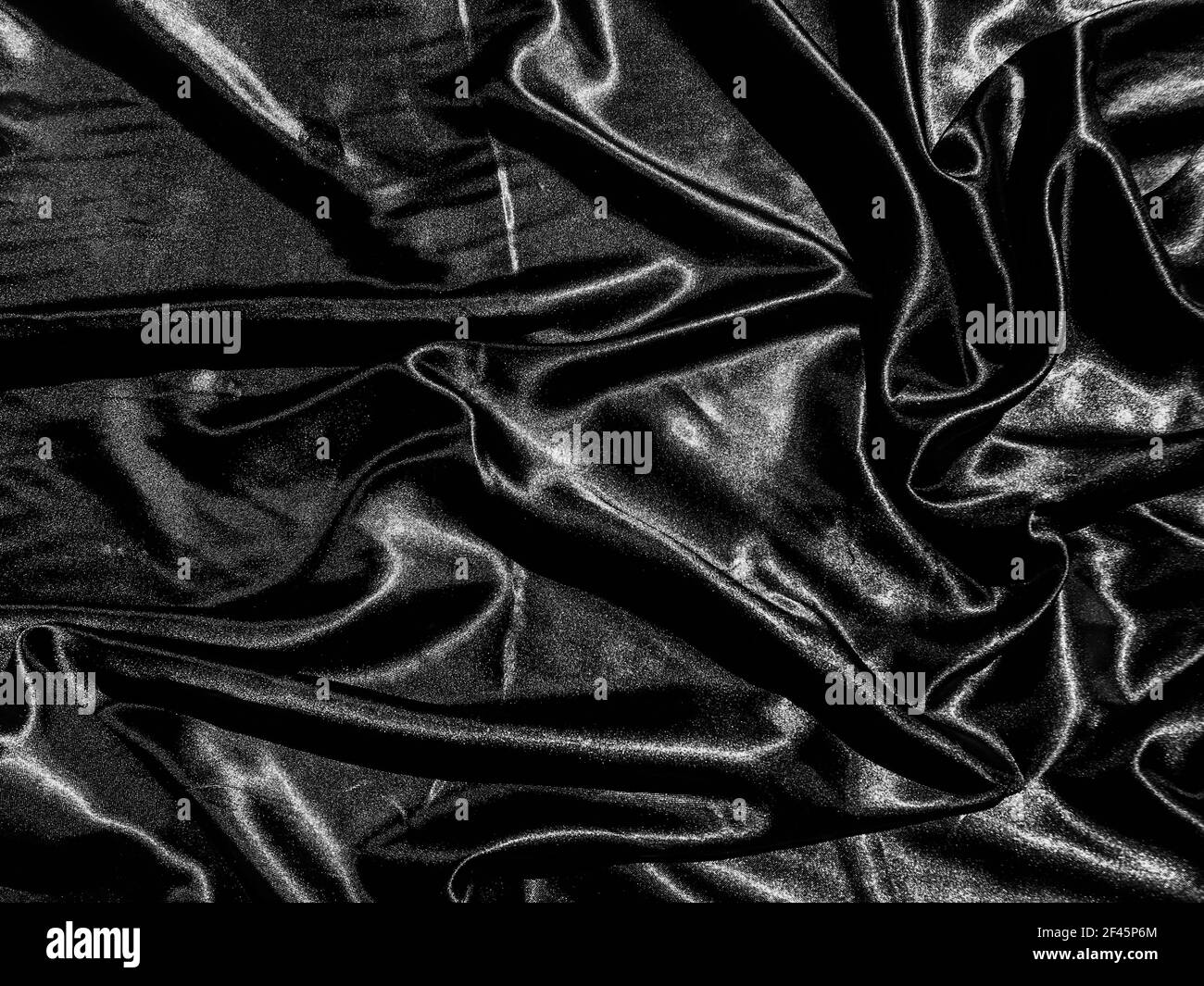 Black cloth or fabric texture background with liquid wave or wavy folds ...