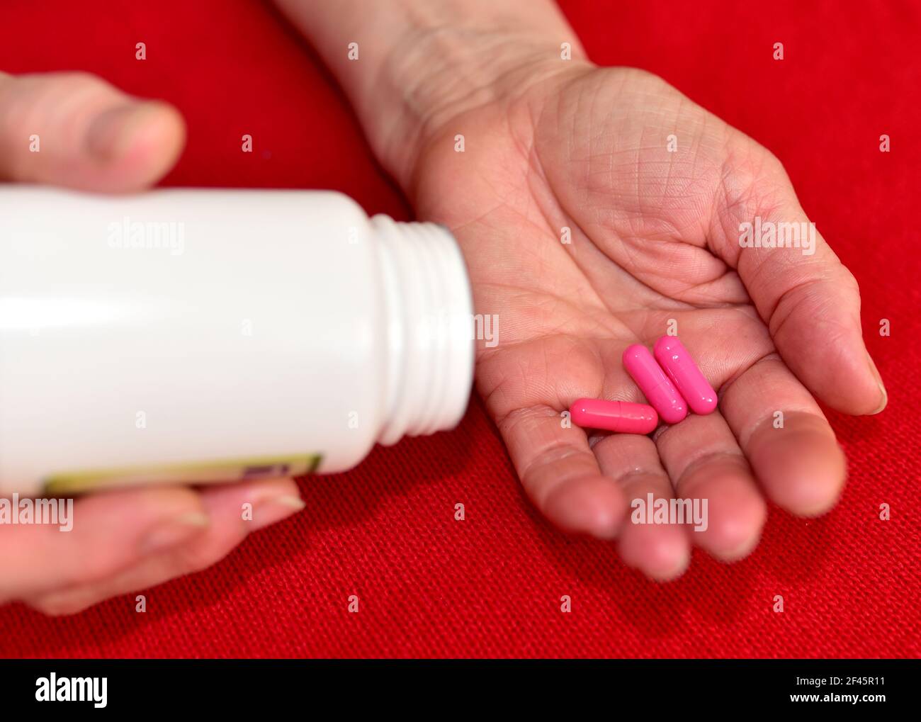 Pills in capsules in woomen hand. Medicine grade pharmaceutical tablets ...