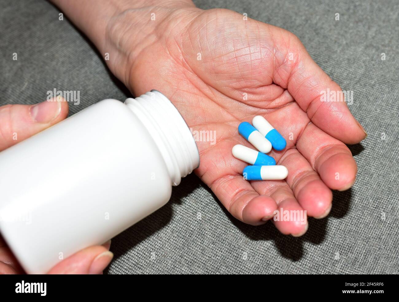 Pills in capsules in woomen hand. Medicine grade pharmaceutical tablets ...
