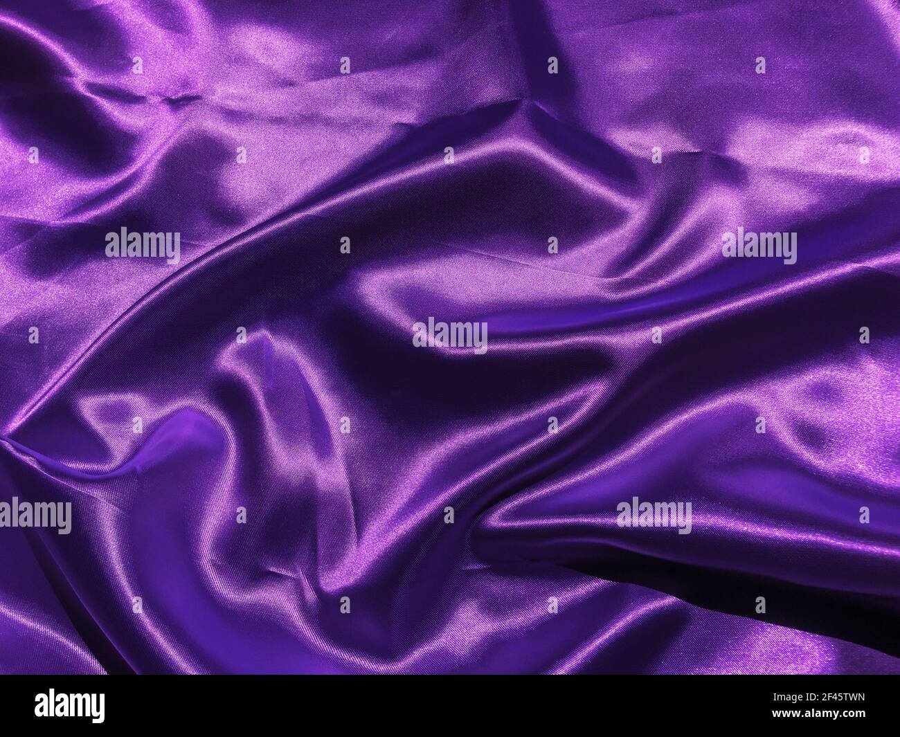 Beautiful smooth purple fabric texture background with copy space for ...