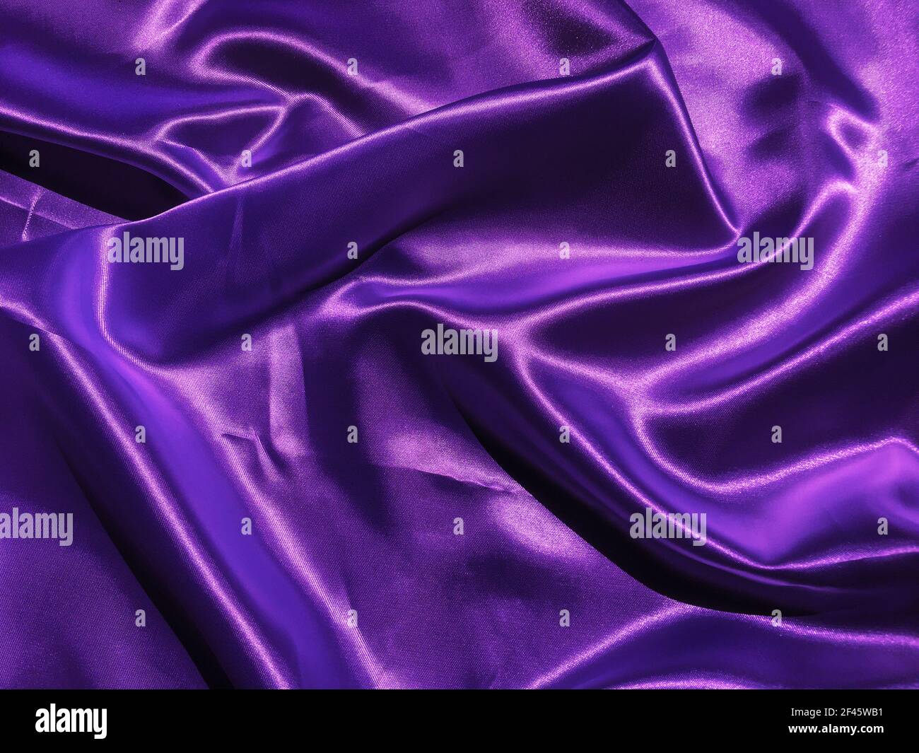 Beautiful smooth purple fabric texture background with copy space for ...