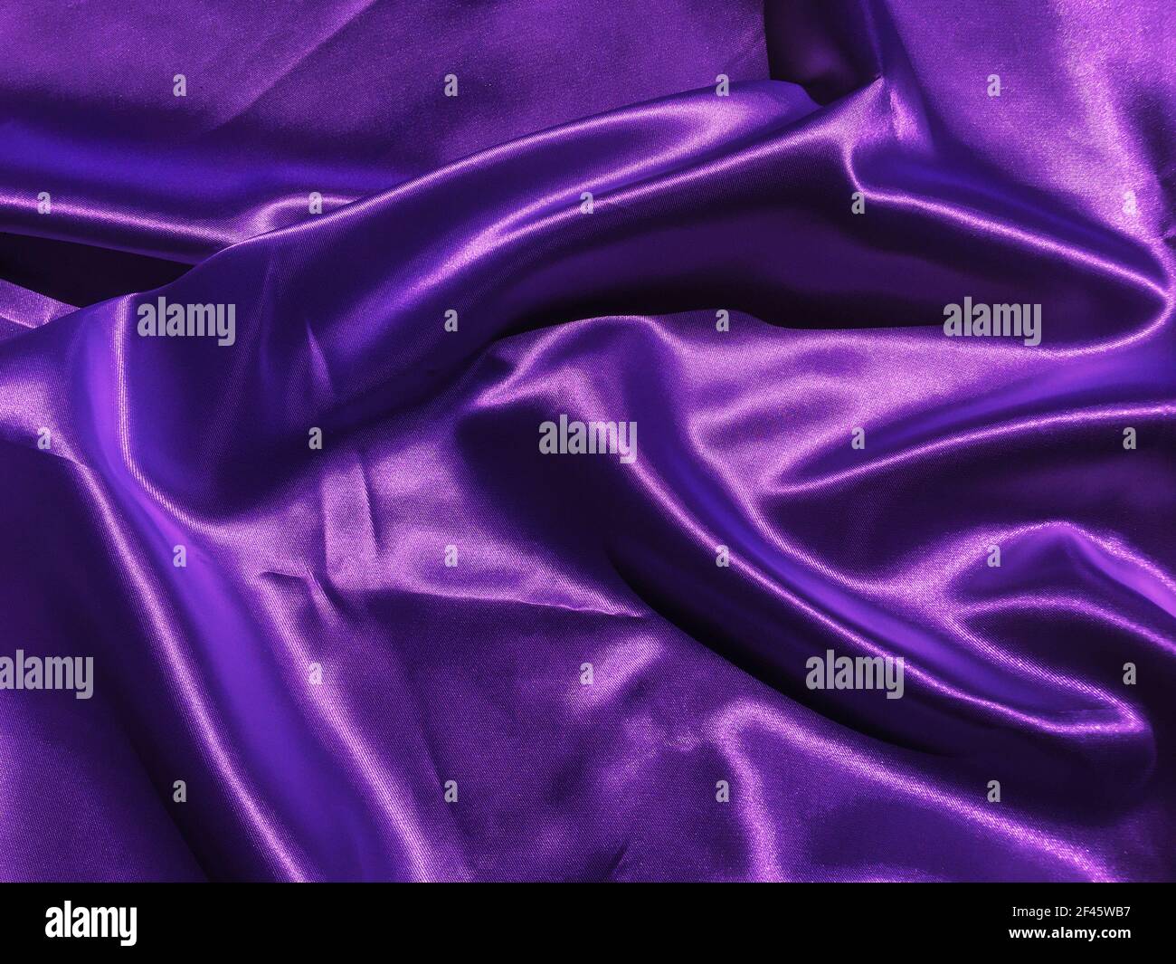 Beautiful smooth purple fabric texture background with copy space for ...