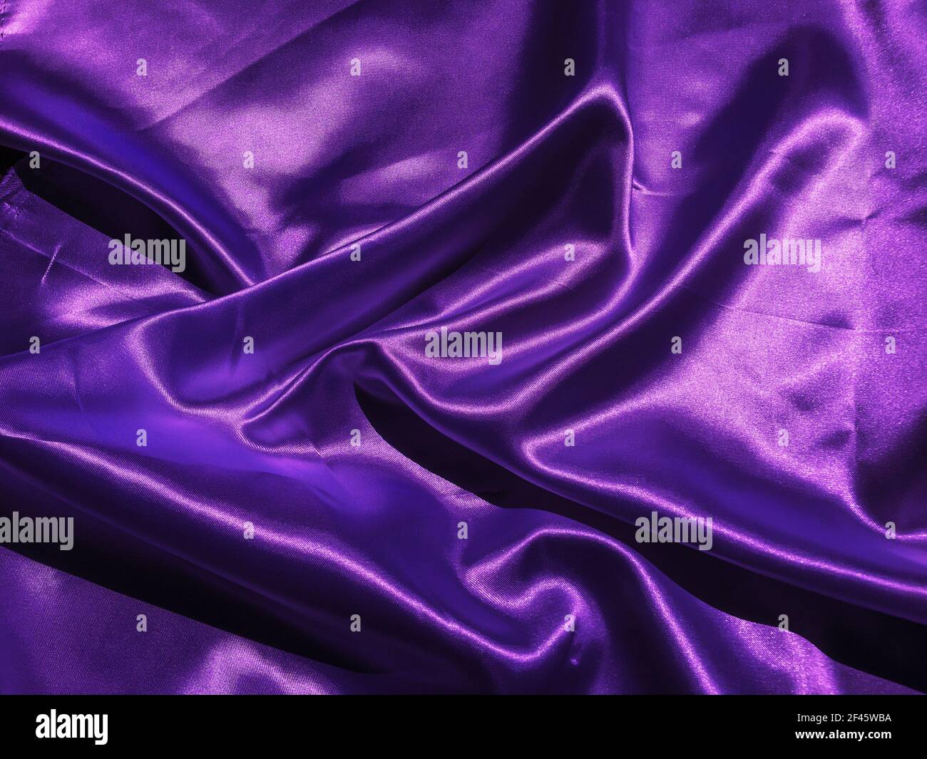 Beautiful smooth purple fabric texture background with copy space for ...