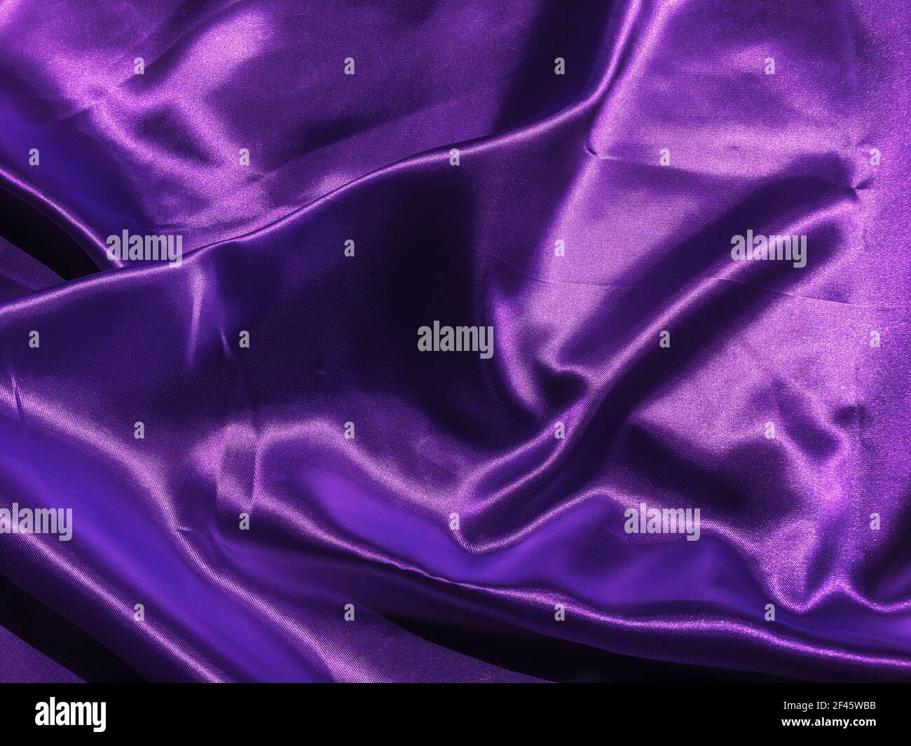 Beautiful smooth purple fabric texture background with copy space for ...