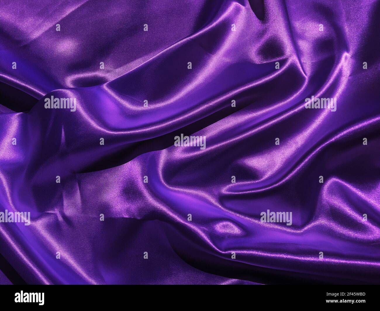 Beautiful smooth purple fabric texture background with copy space for ...