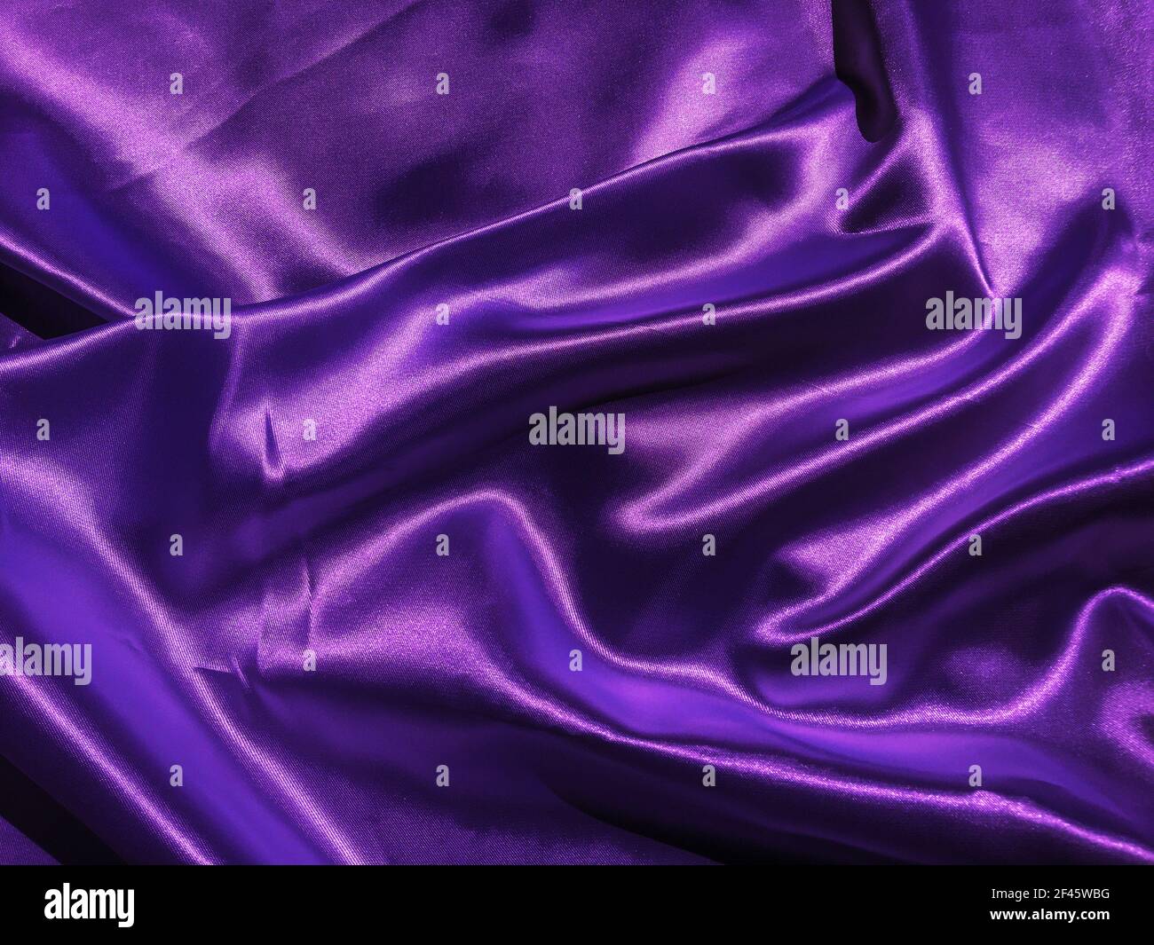 Beautiful smooth purple fabric texture background with copy space for ...
