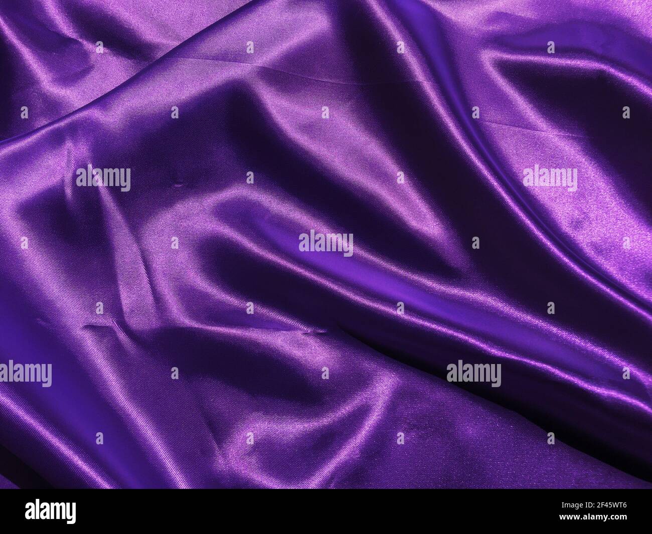 Beautiful smooth purple fabric texture background with copy space for ...