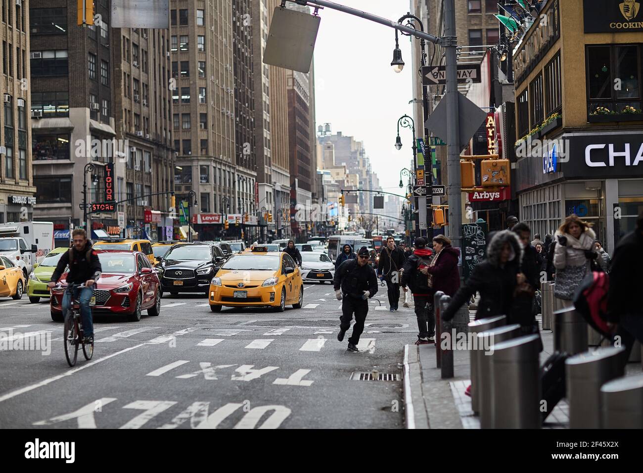 a busy road in new york city with people on the street Stock Photo - Alamy