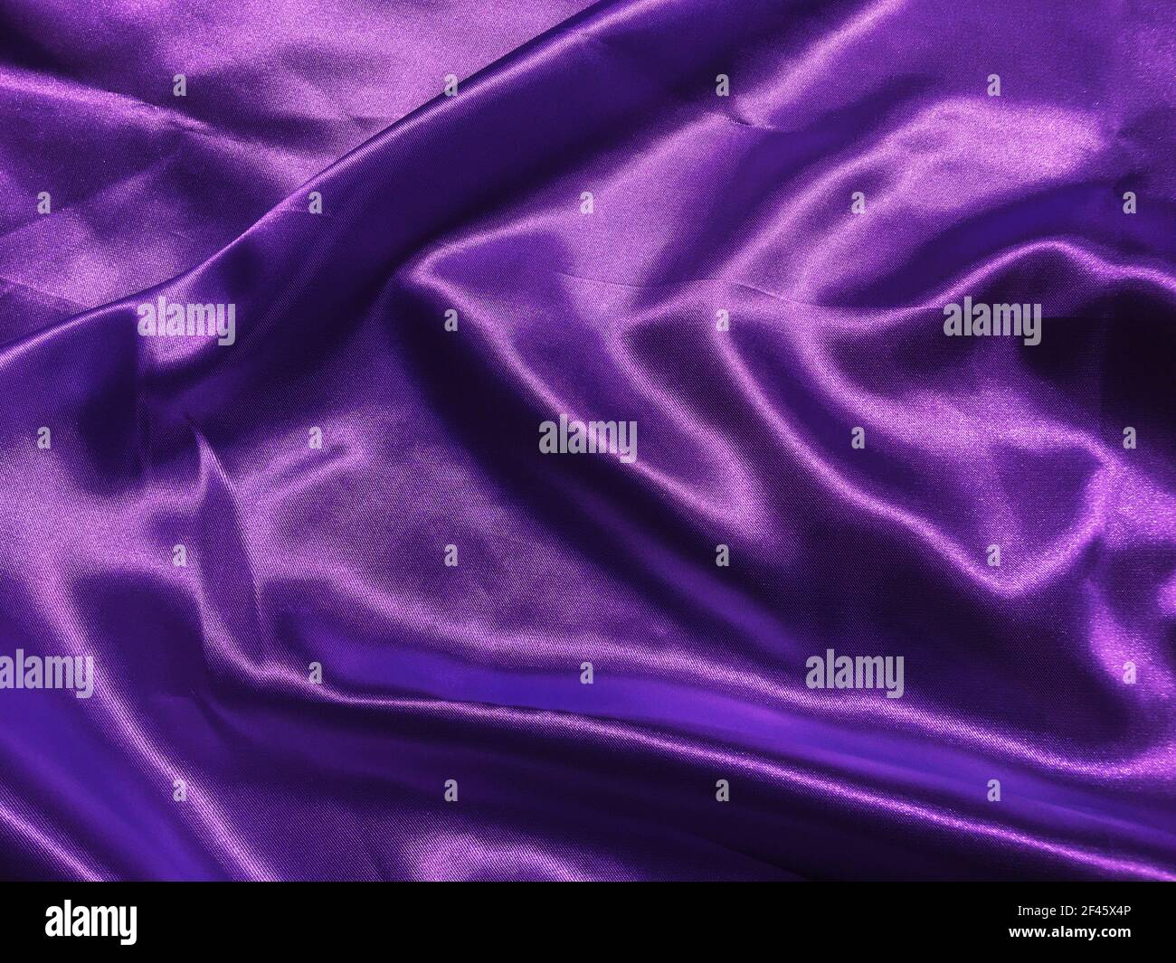 Beautiful smooth purple fabric texture background with copy space for ...