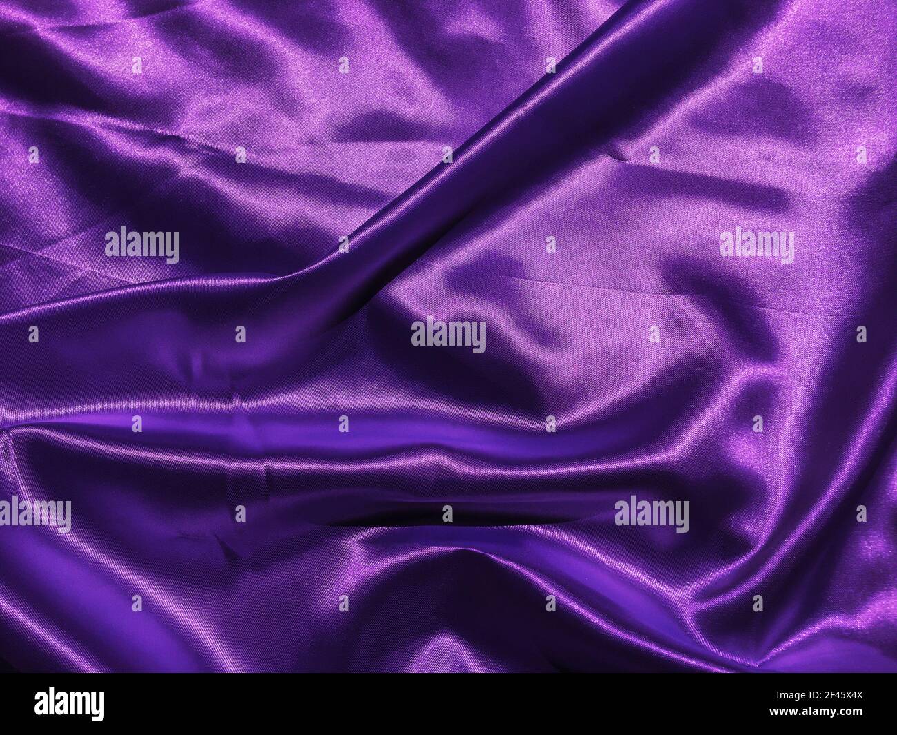 Beautiful smooth purple fabric texture background with copy space for ...