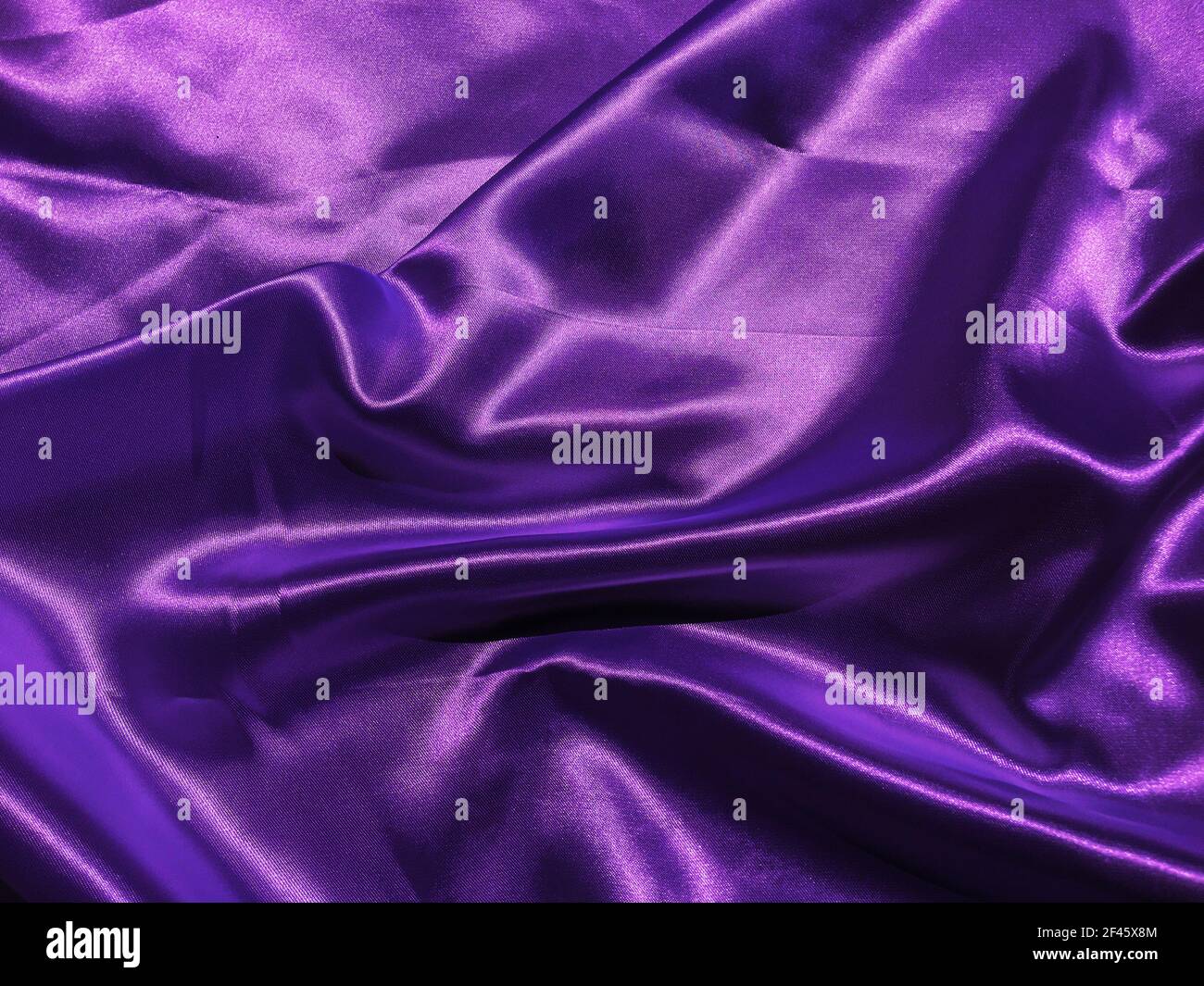 Beautiful smooth purple fabric texture background with copy space for ...