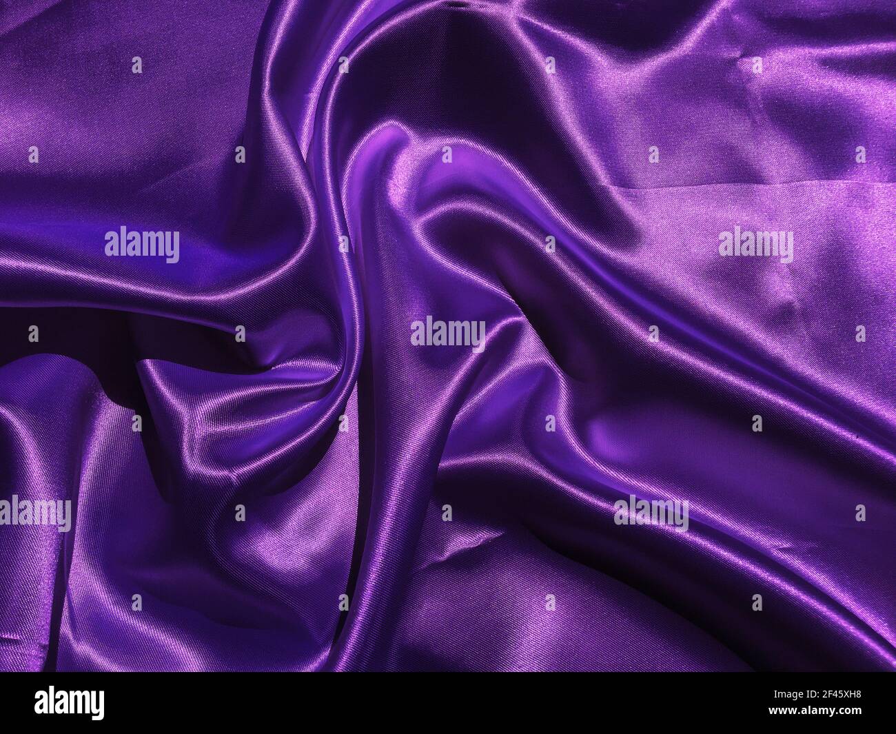 Smooth purple fabric or satin texture background with copy space for ...