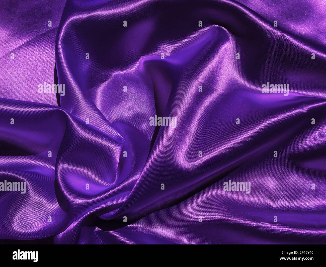 Smooth purple fabric or satin texture background with copy space for ...