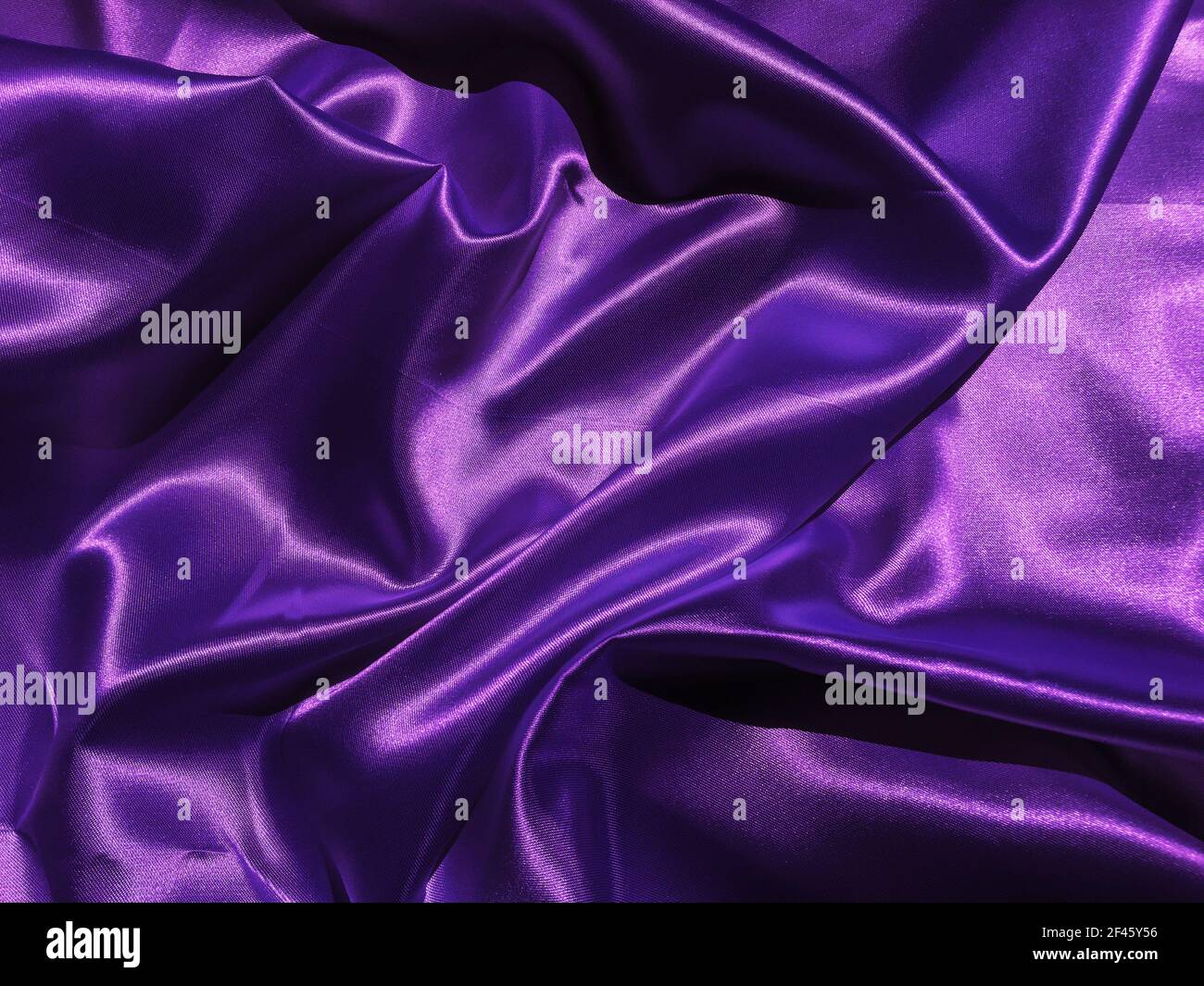 Smooth purple fabric or satin texture background with copy space for ...