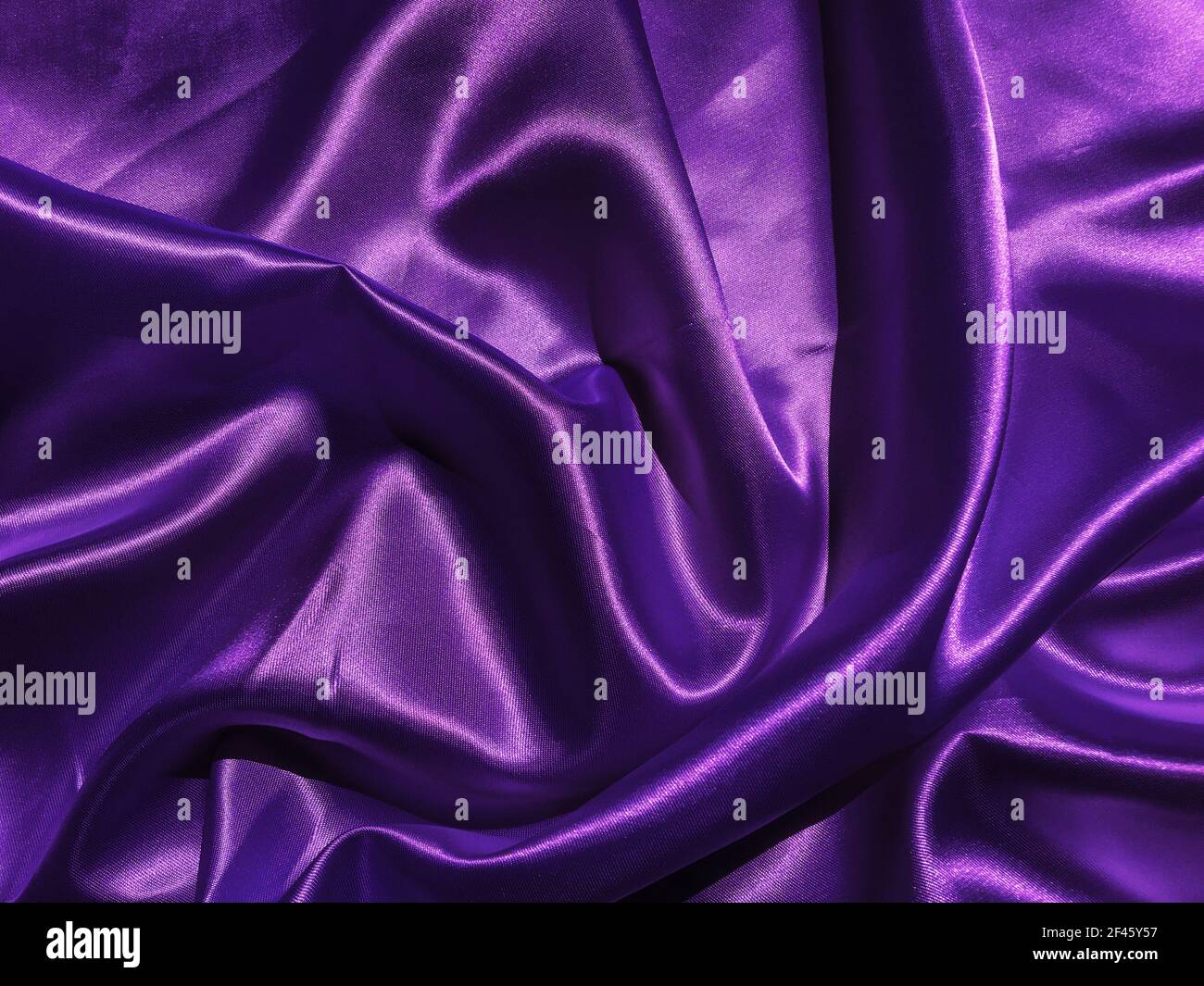 Smooth purple fabric or satin texture background with copy space for ...